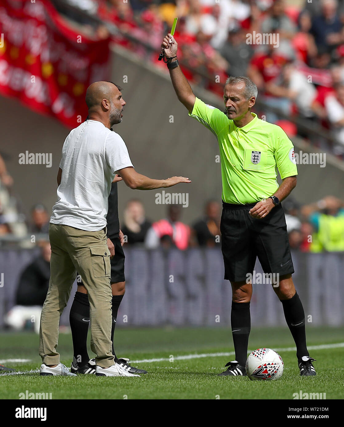 Manchester City manager Pep Guardiola is shown the yellow card during ...