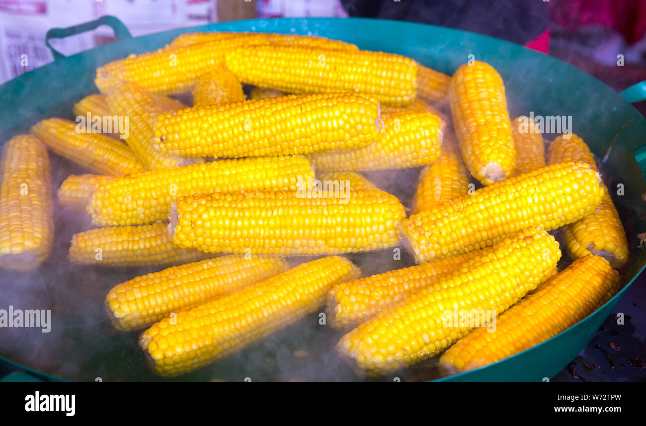 Steamed corn cobs cooking, smorgasbord Stock Photo - Alamy