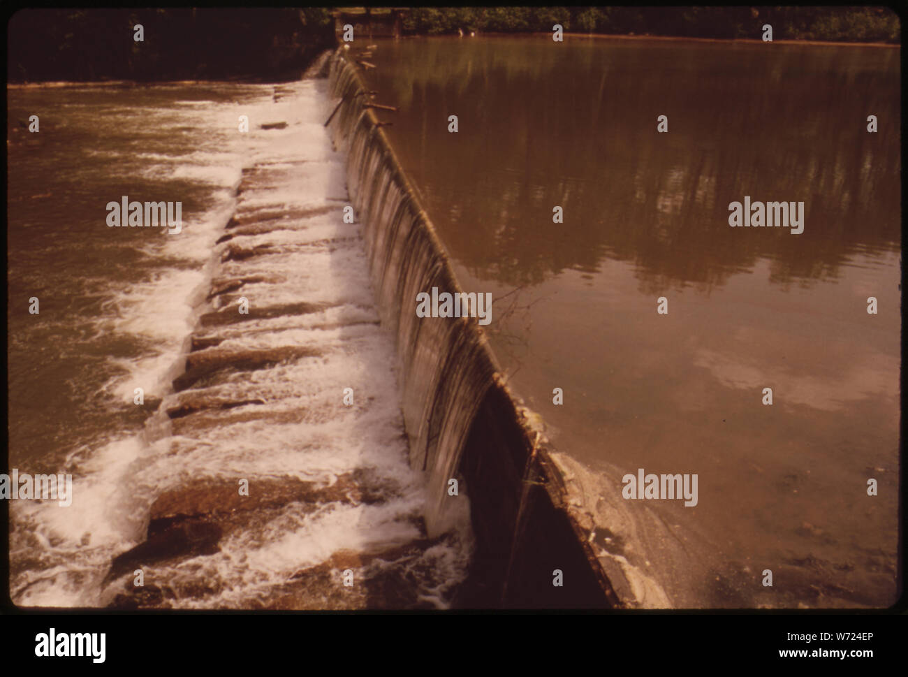 DAM BELOW THE WEYERHAEUSER PAPER MILL ON THE WHITMAN RIVER IS ALMOST ...