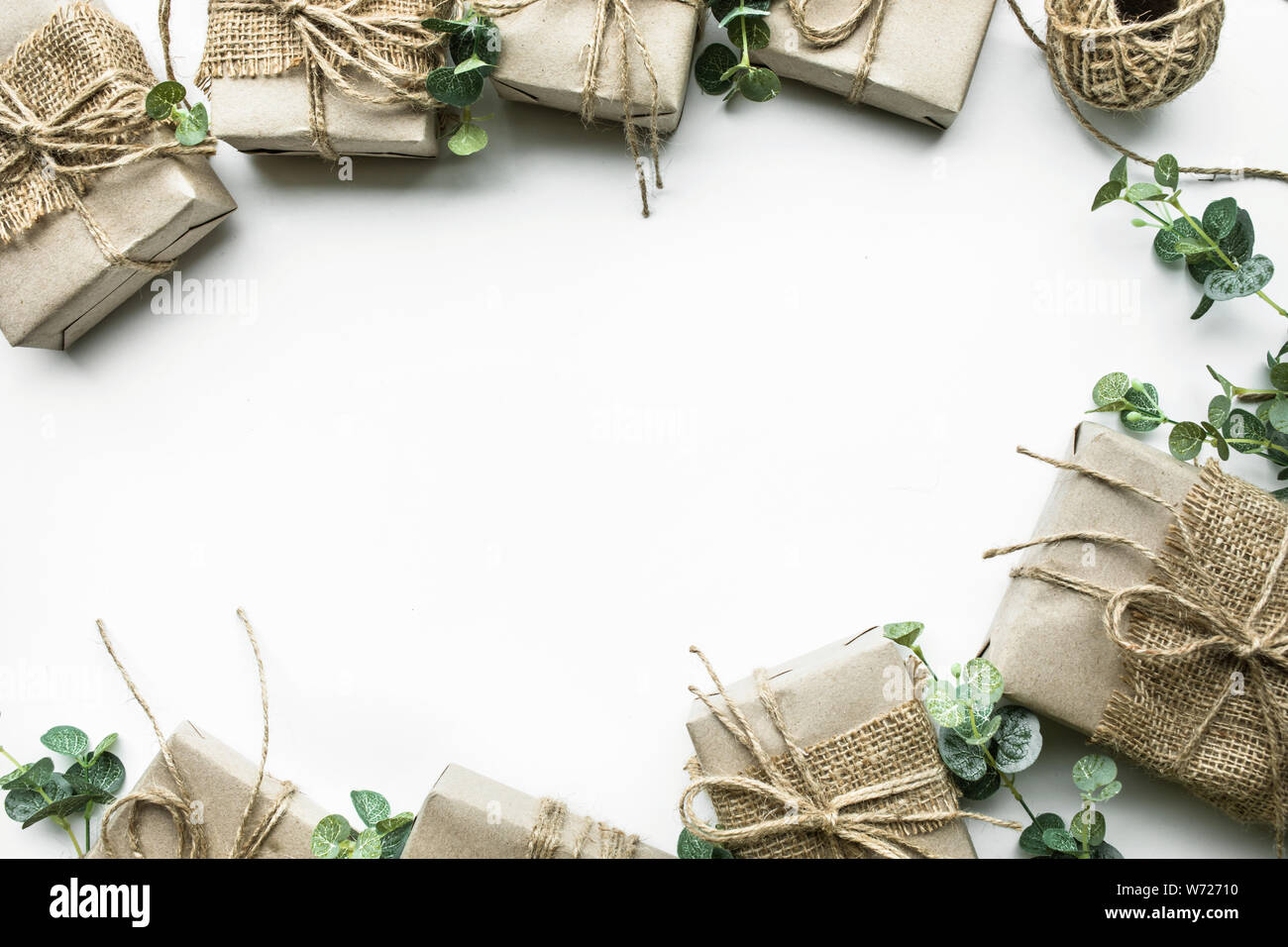 Gift boxes collection wrapped in kraft paper minimal style with leaves ...