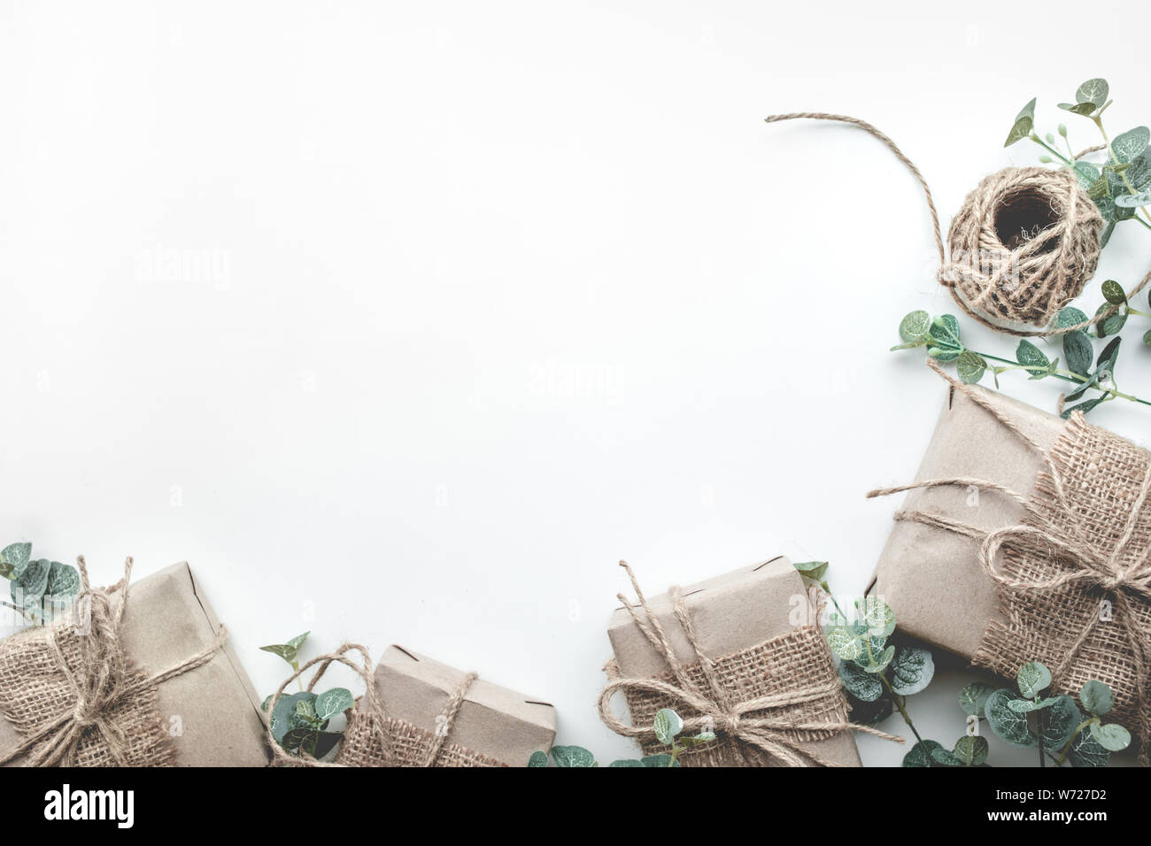 Gift boxes collection wrapped in kraft paper minimal style with leaves ...