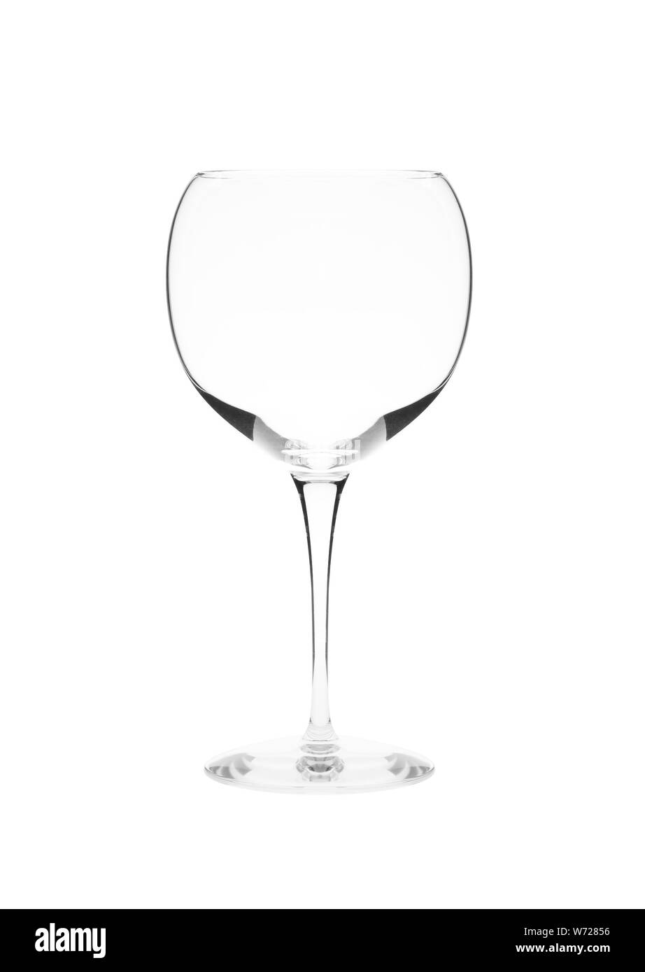Empty vine glass on white isolated over white Stock Photo - Alamy