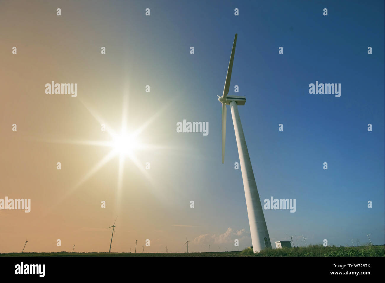 Photo of Wind power installation in sunny day Stock Photo - Alamy