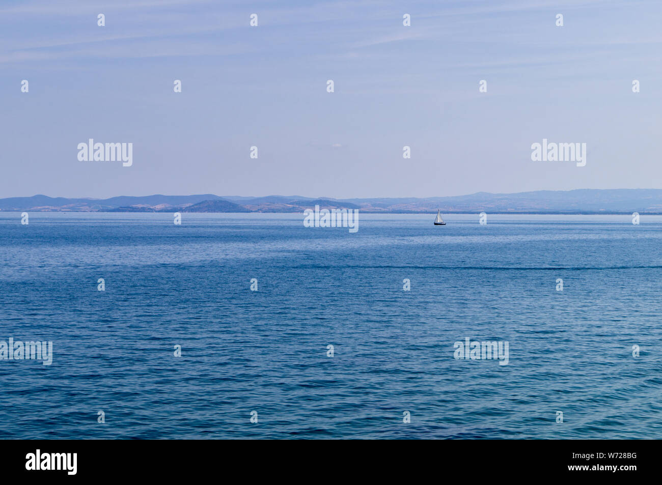 Panorama of the Tuscan sea with a sailboat Stock Photo - Alamy
