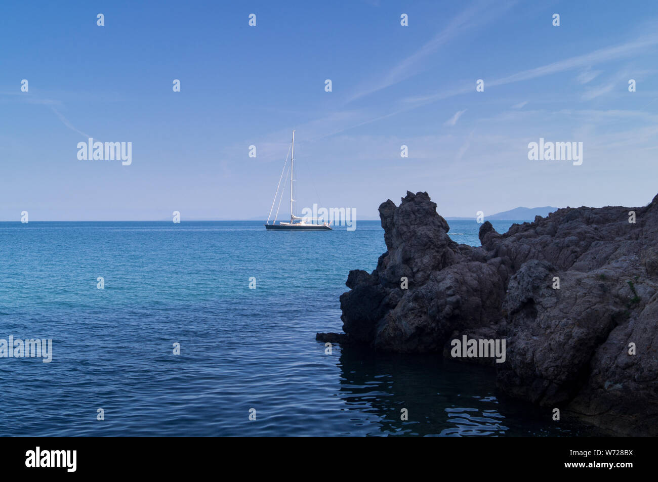 Panorama of the Tuscan sea with a sailboat Stock Photo - Alamy