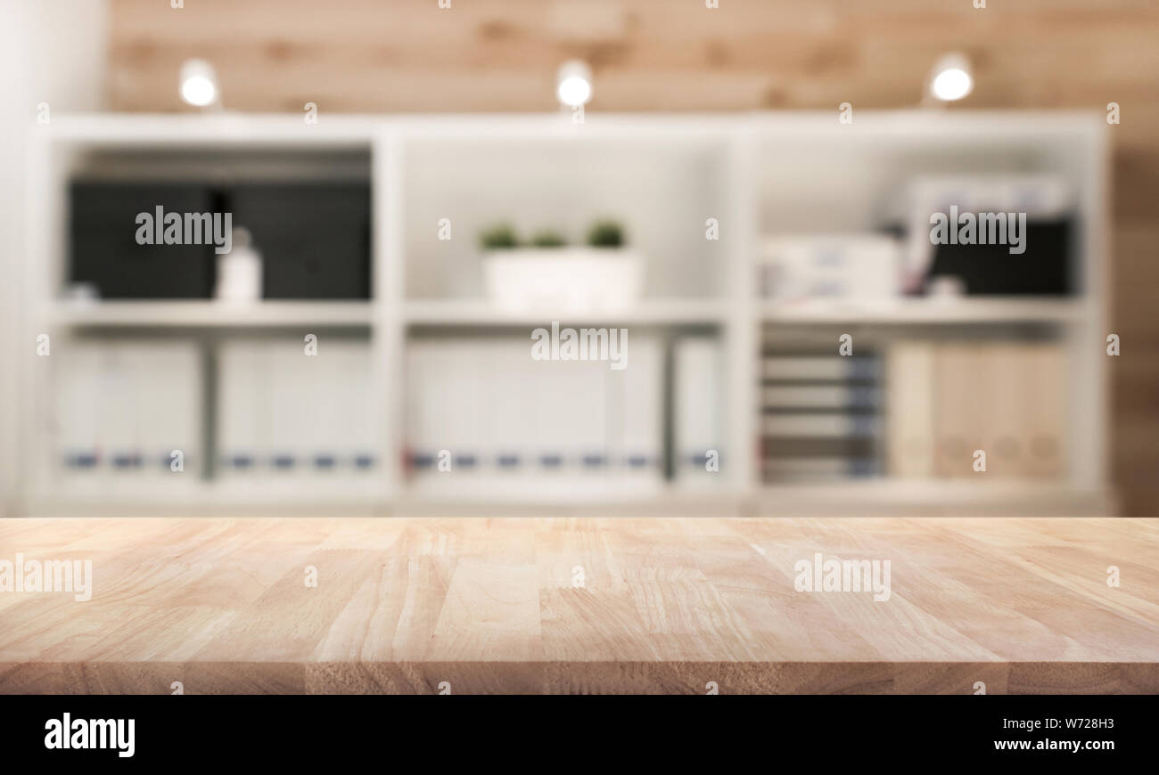 Real wood table top texture on room interior background.For create ...