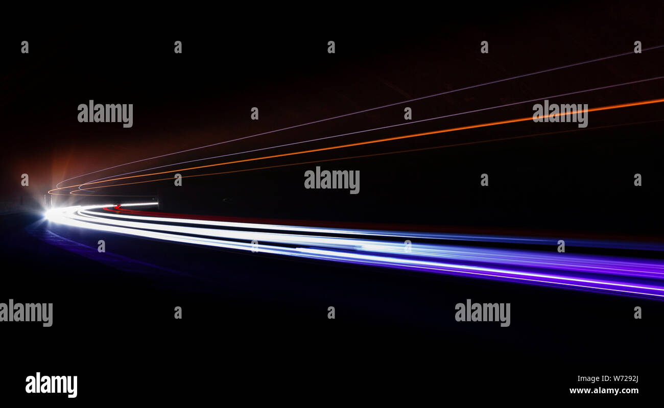 Light tralight trails in tunnel. Art image. Long exposure photo taken ...