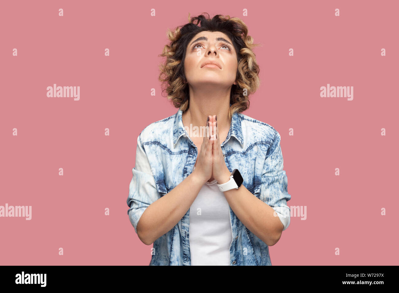 Woman alone standing prayer hands hi-res stock photography and images ...