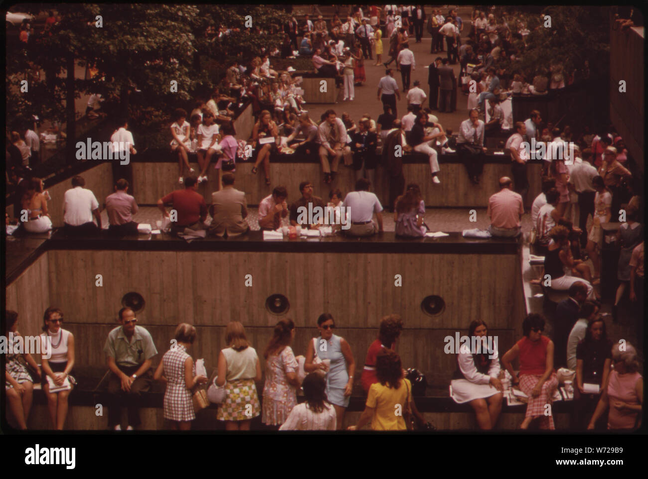 FOUNTAIN SQUARE'S SITTING WALLS ARE WELL USED DURING A NOONTIME CONCERT ...