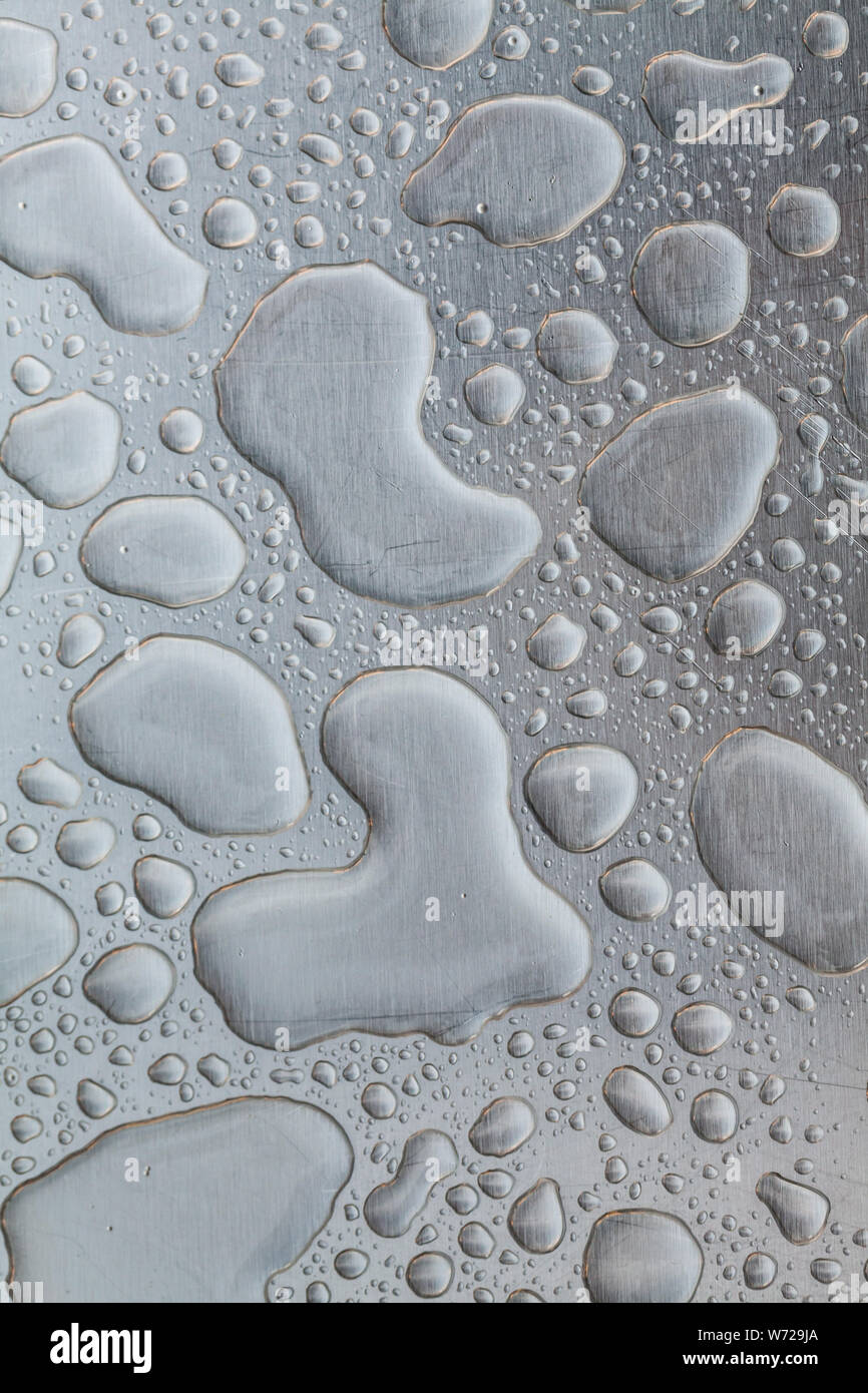 Metal surface covered in water drops bottom, closeup Stock Photo - Alamy