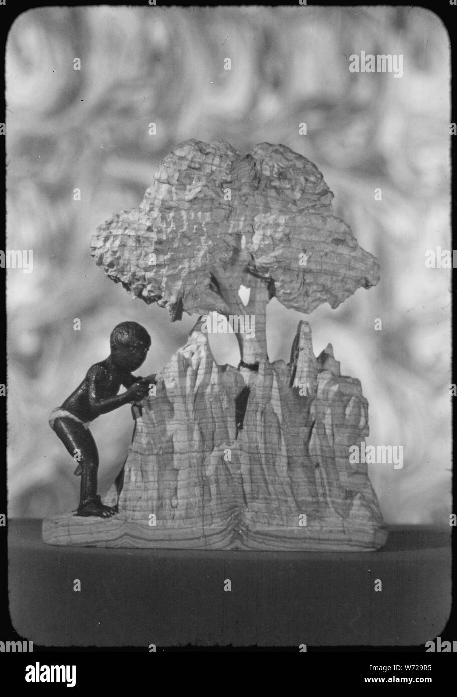 Farmer cutting bush; General notes: Thorn carving (sculpture carved ...