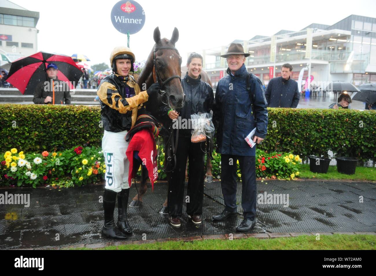 Jockey Paul Townend (left), groom Rachel Robbins and trainer Willie ...