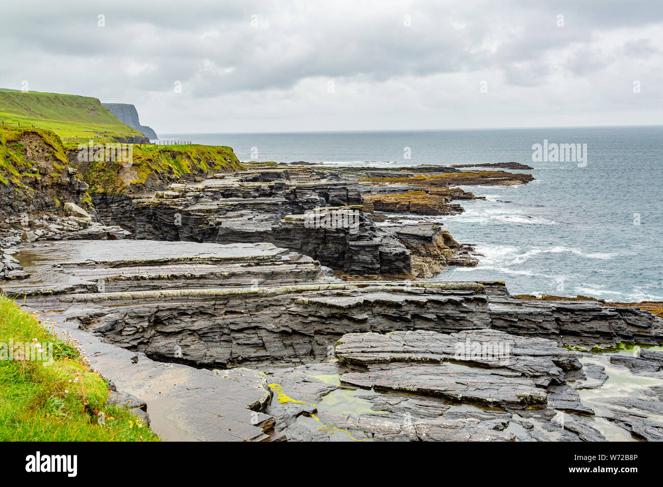 Irish landscape of limestone pavement along the coastal walk route from ...