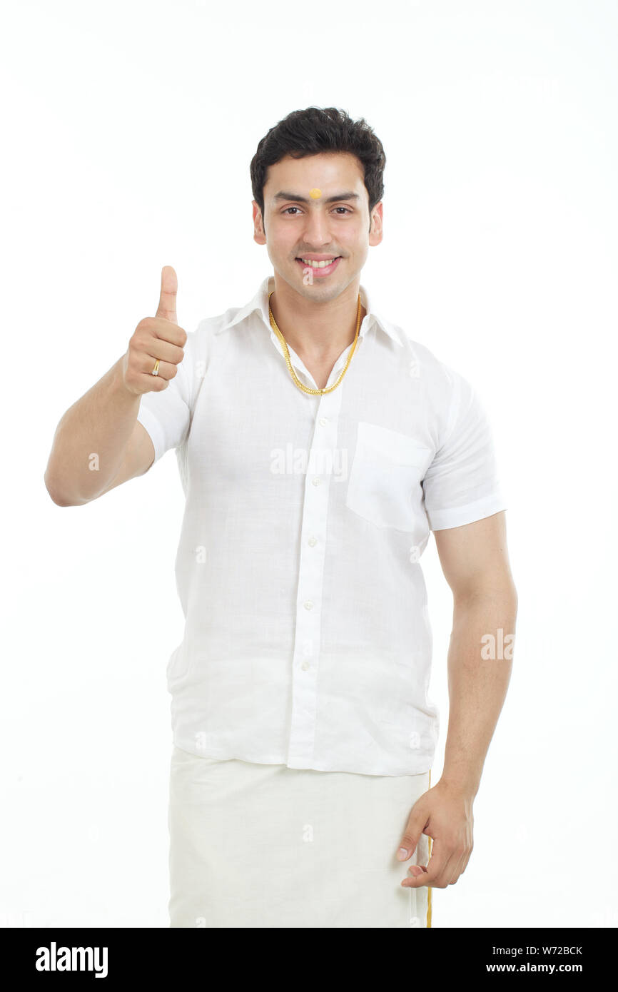 South Indian man showing thumbs up sign Stock Photo - Alamy