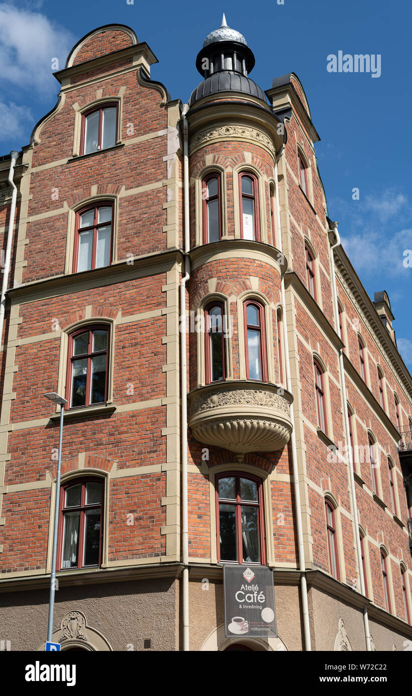 An ornate brick building with rounded turrets on the edge. Orebro ...