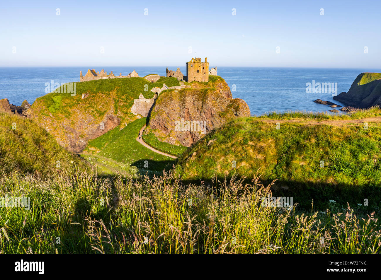 white angel view Dunnottar castle in a golden afternoon light Stock ...