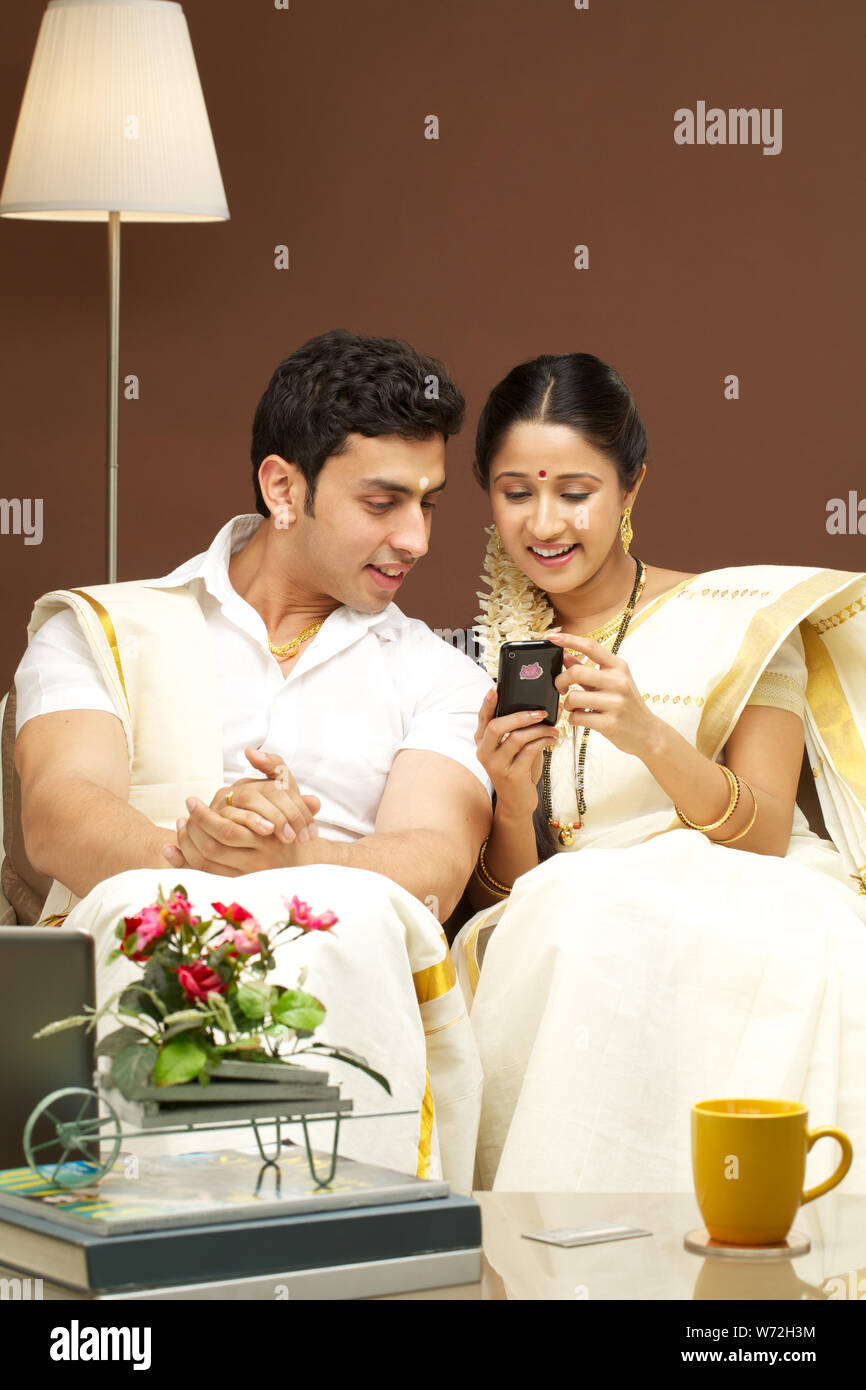 Indian couple watching movie hi-res stock photography and images - Alamy