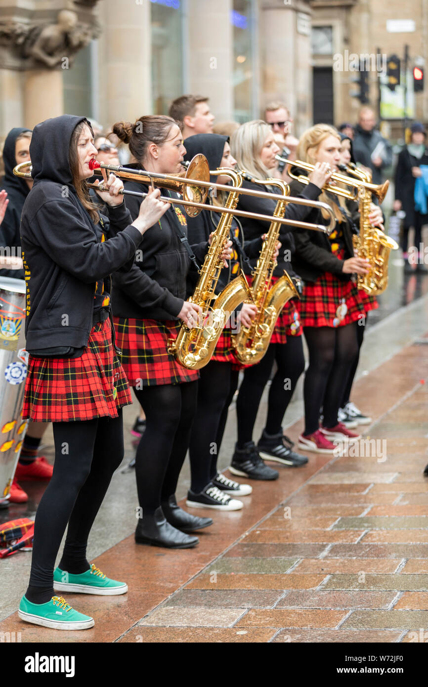 music band with traditional Scottish kilts performing in Glasgow city ...