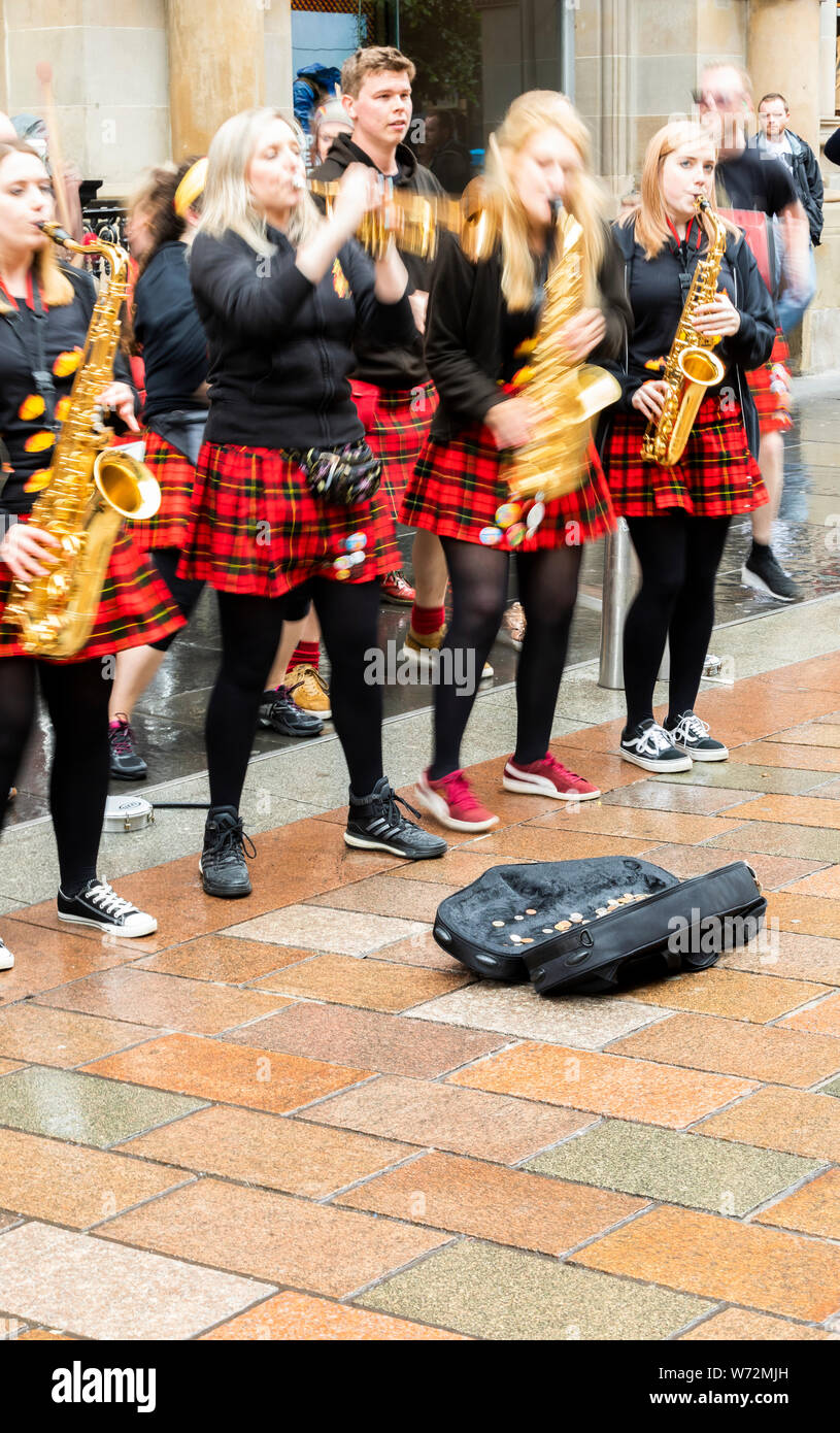 music band with traditional Scottish kilts performing in Glasgow city ...
