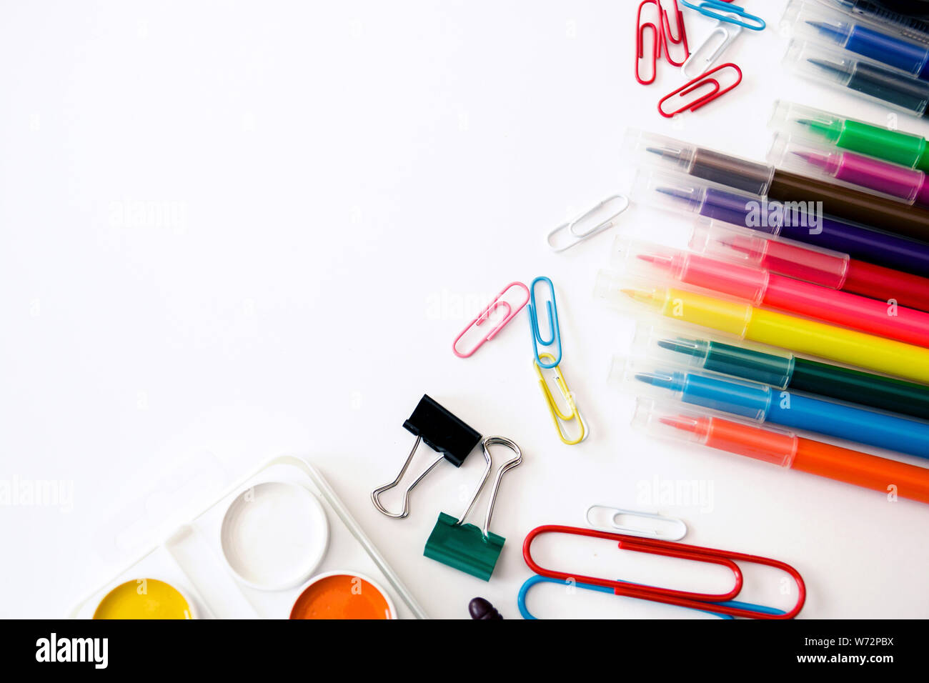 Colorful stationary school supplies on white background, space or text ...