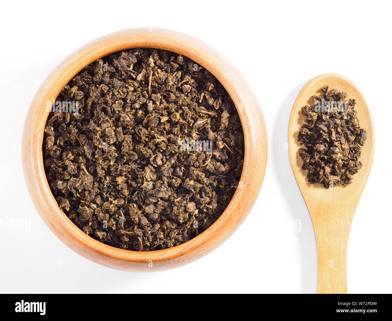 Fermented granular tea from Cherry (Cerasus) leaves in wooden cup with ...