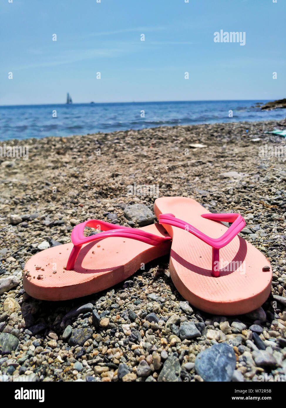 Flip-flop shoes on a beach Stock Photo - Alamy