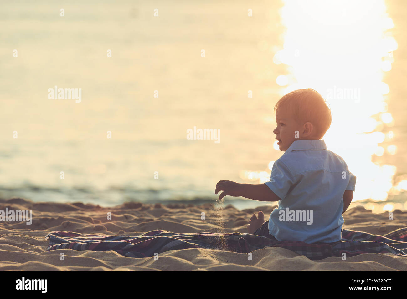 Child siting hi-res stock photography and images - Alamy