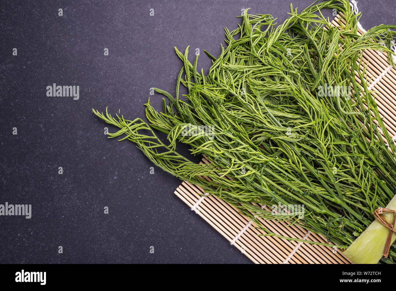Top view fresh green Acacia pennata on black stone background Stock ...