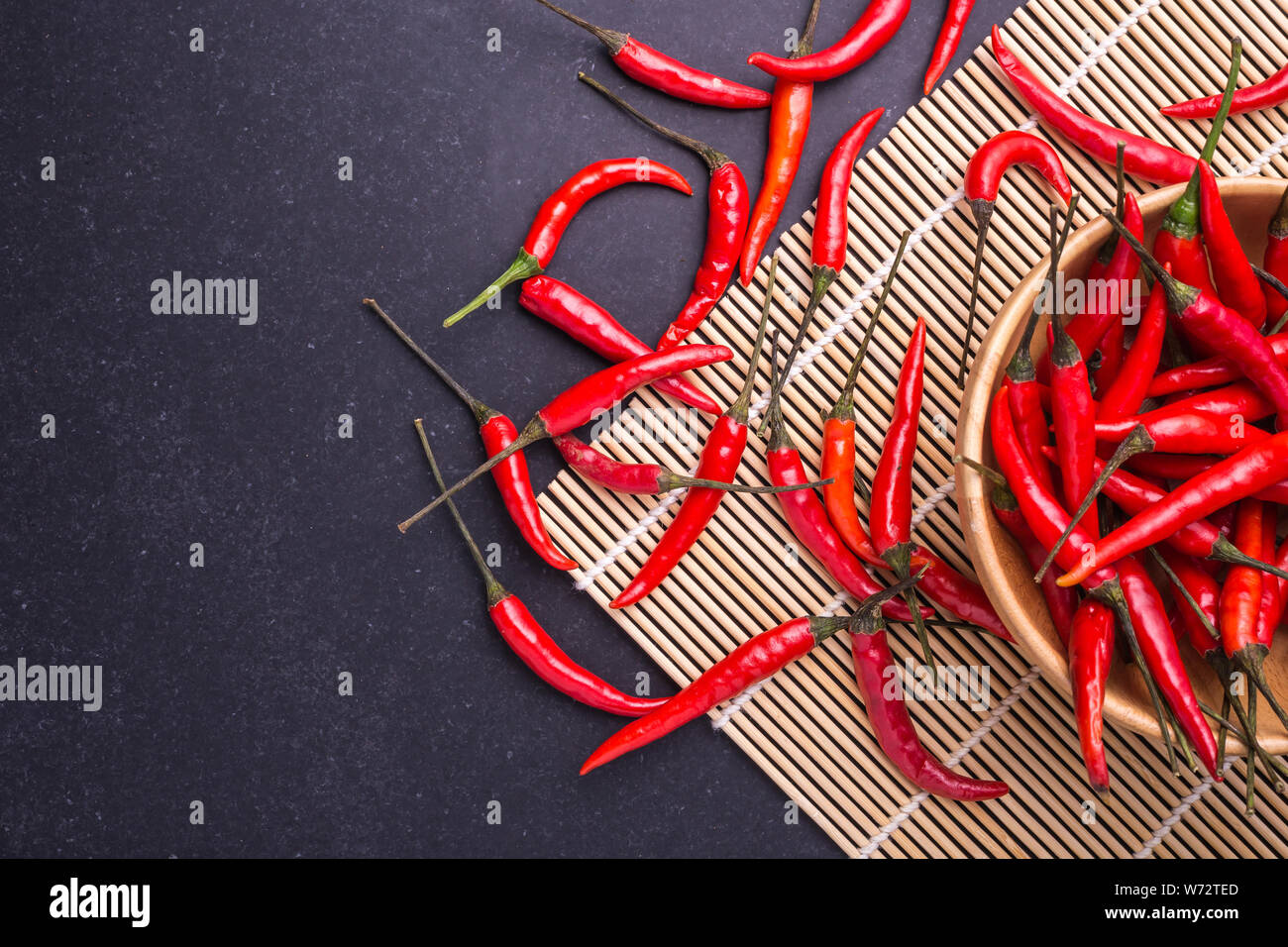 Top view fresh red hot chilli on black stone board background Stock ...