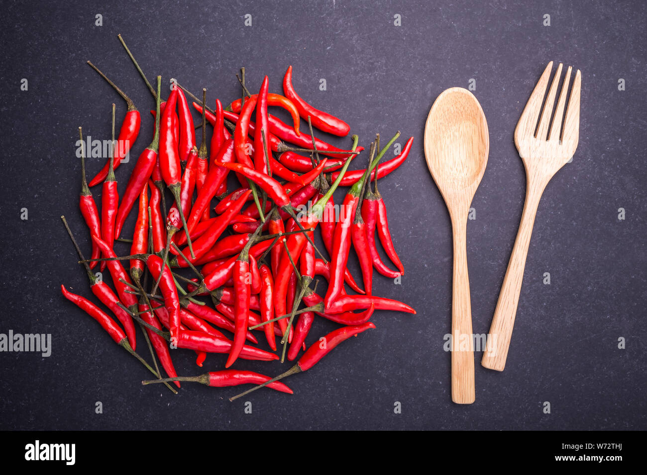 Top view fresh red hot chilli on black stone board background Stock ...