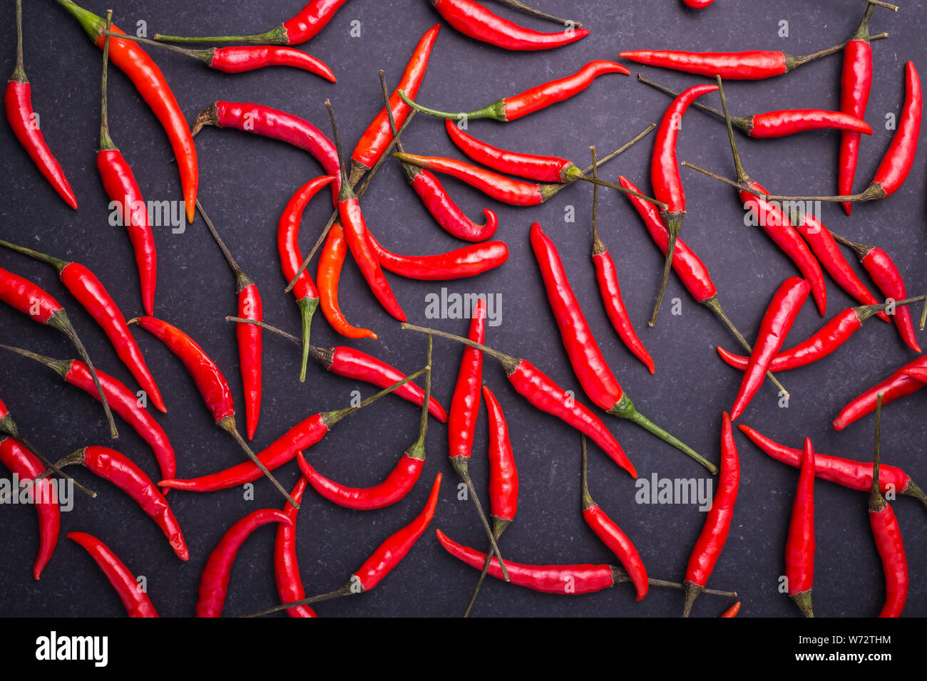 Top view fresh red hot chilli on black stone board background Stock ...