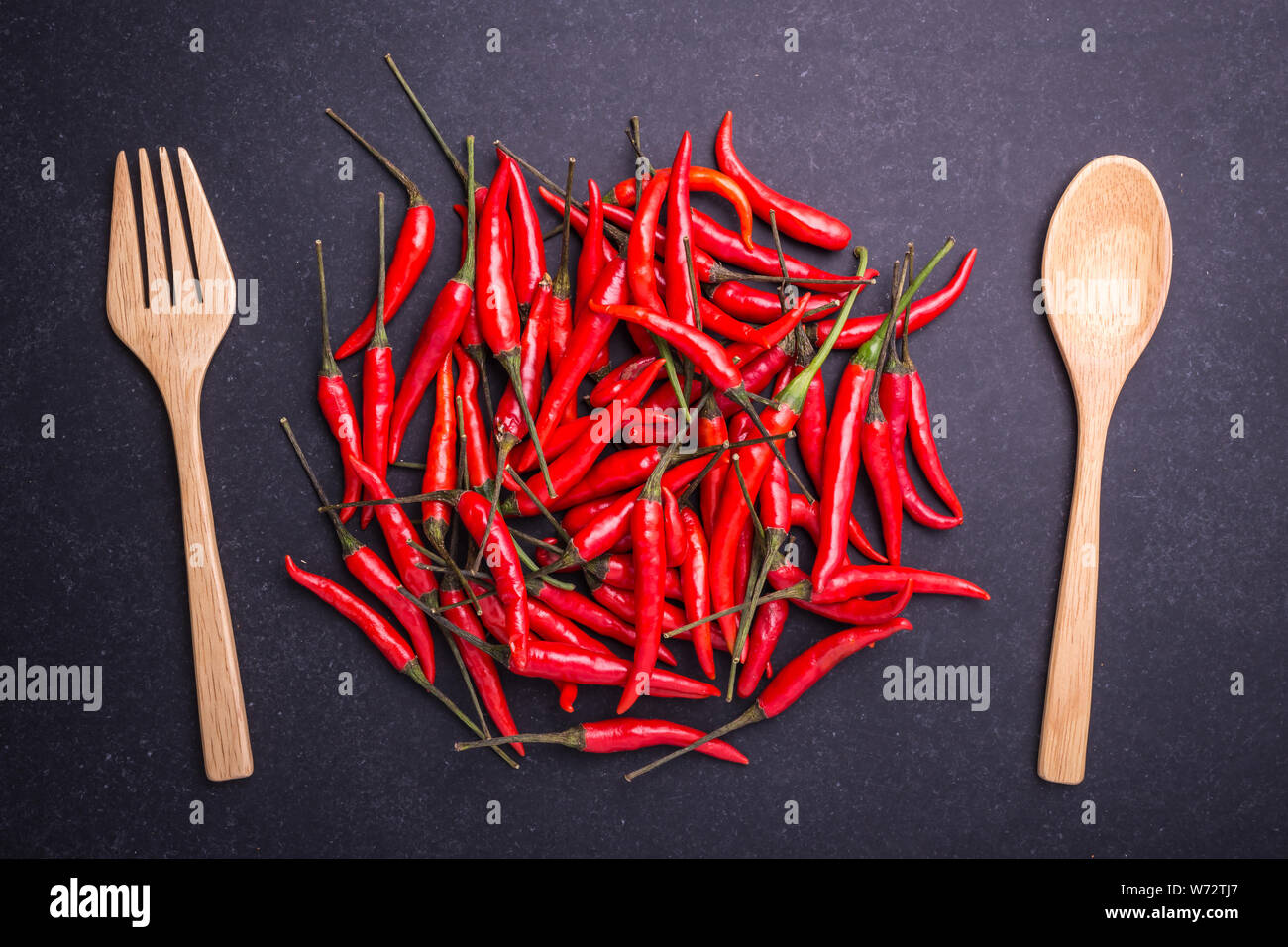 Top view fresh red hot chilli on black stone board background Stock ...