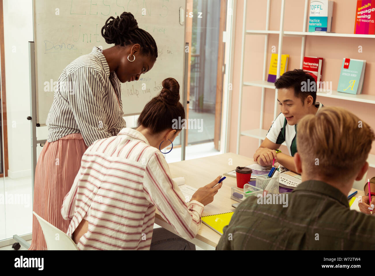 Group of delighted people discussing their exam Stock Photo - Alamy