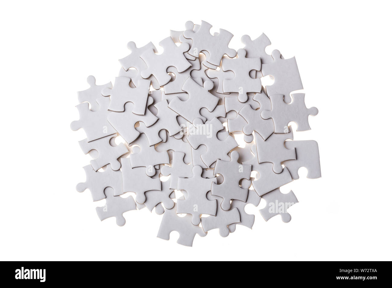 Jigsaw puzzle pieces pile Cut Out Stock Images & Pictures - Alamy