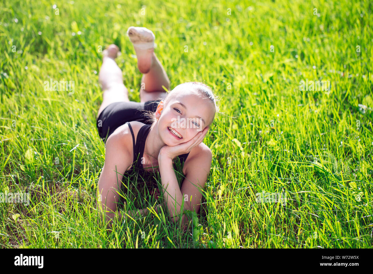 Girl Laying In Grass