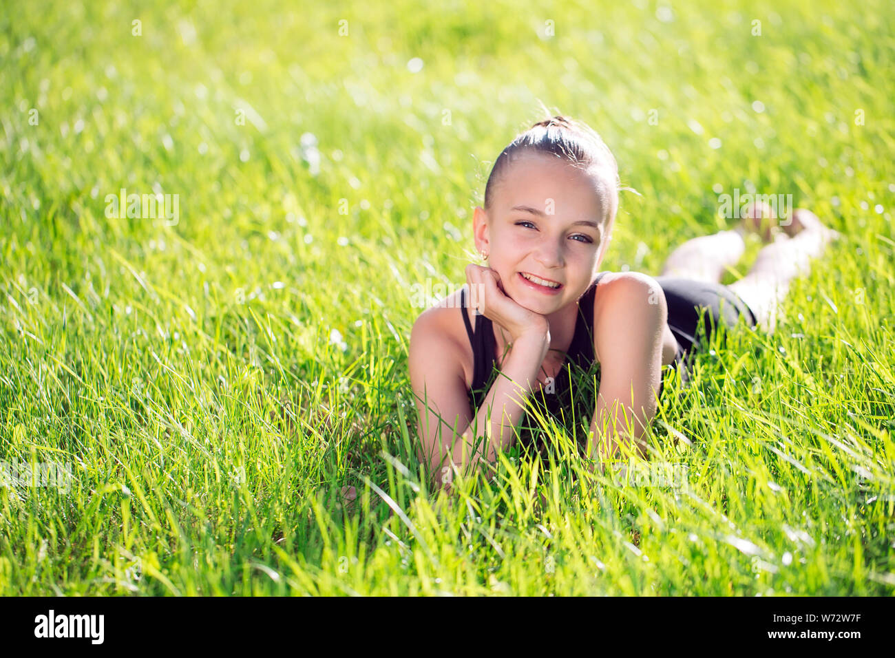 Girl Laying In Grass