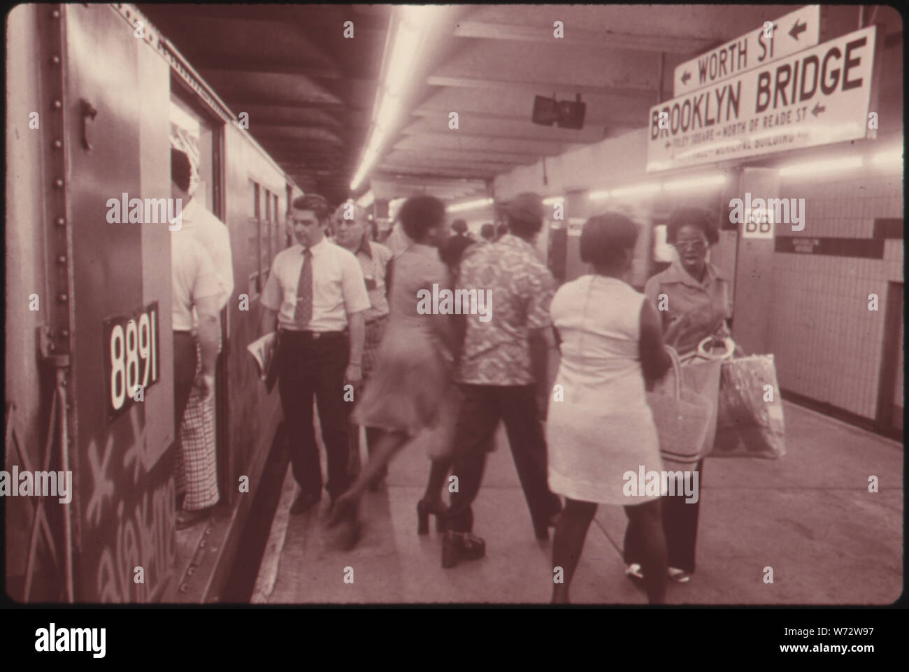 PASSENGERS BOARDING THE LEXINGTON AVENUE LINE SUBWAY IN NEW YORK CITY ...