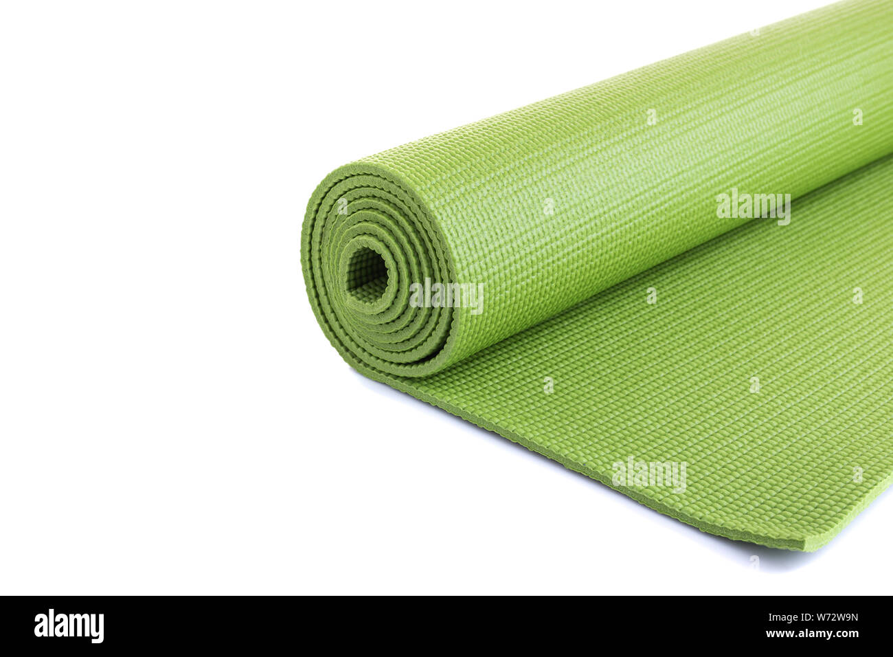 New green soft Yoga mat. Studio shot isolated on white background Stock ...