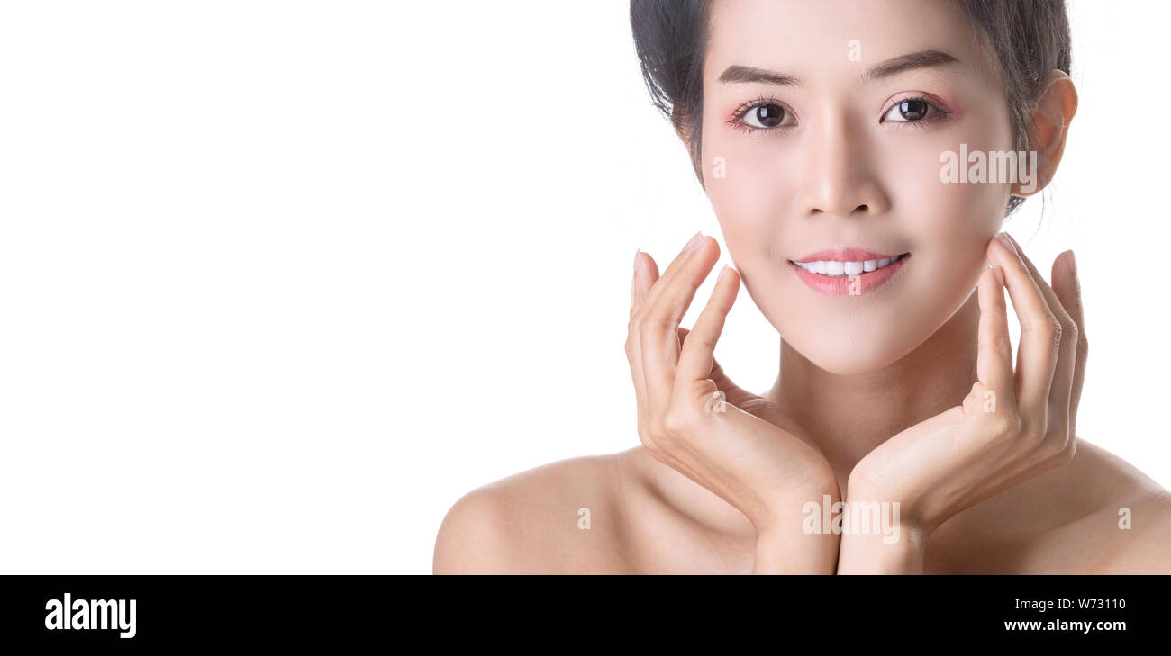 Beautiful Young Asian Woman with Cosmetic on own face. Cosmetologist ...