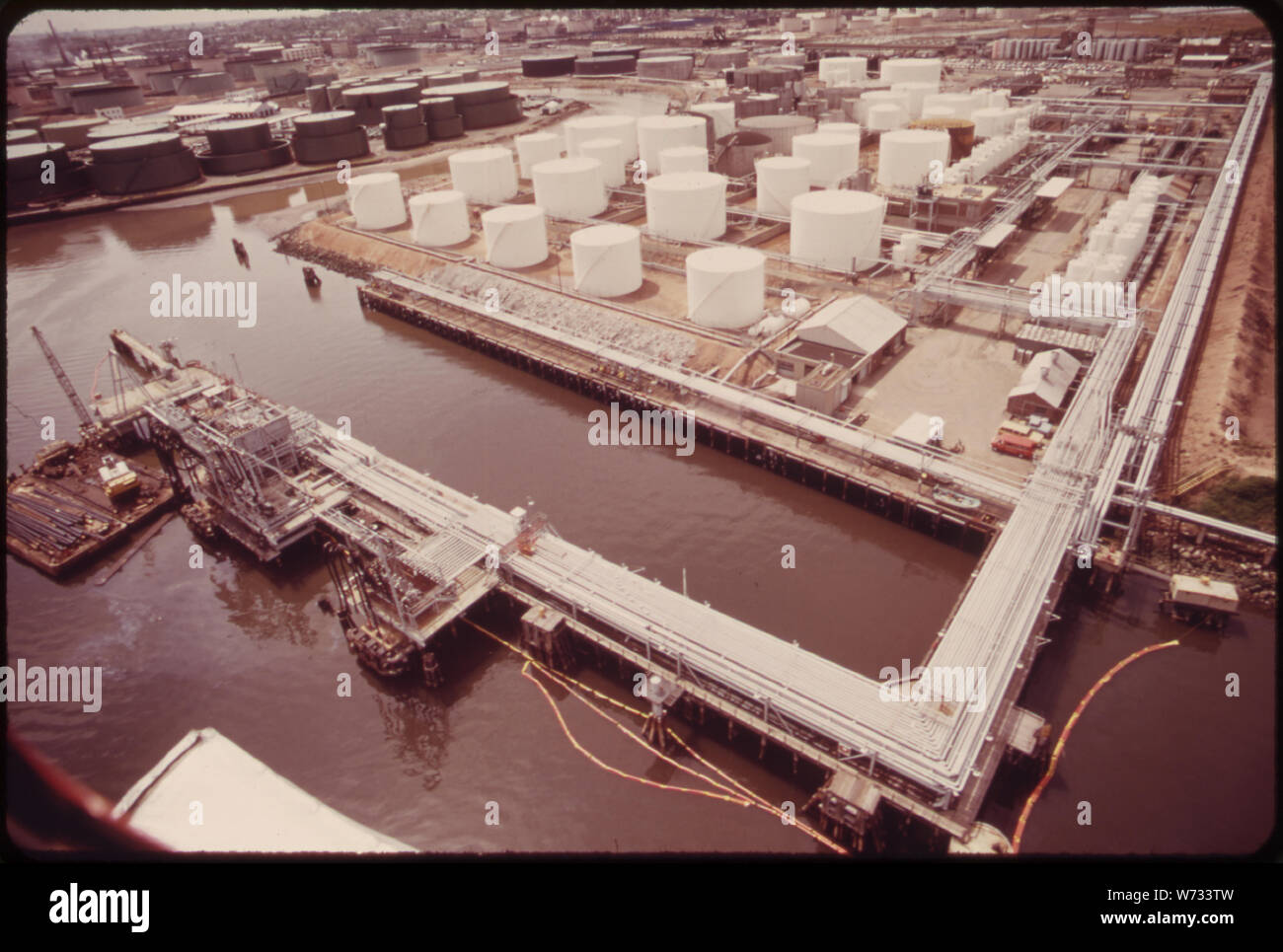 SHELL OIL TANKS ON ARTHUR KILL. THE FLOTATION COLLARS (IN FOREGROUND ...