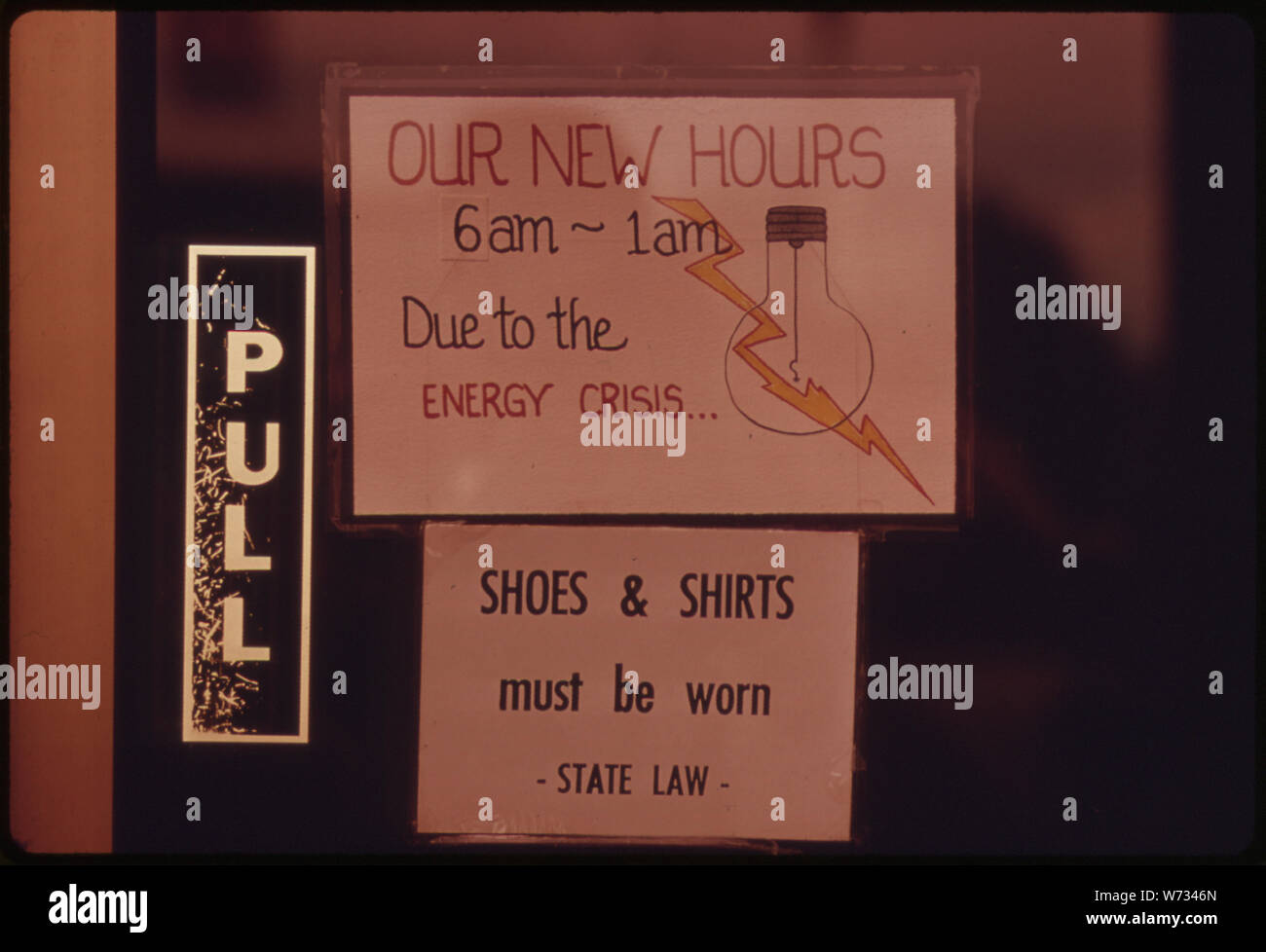 SIGN POSTED IN A DOORWAY ENTRANCE TO A RESTAURANT EXPLAINING SHORTER ...