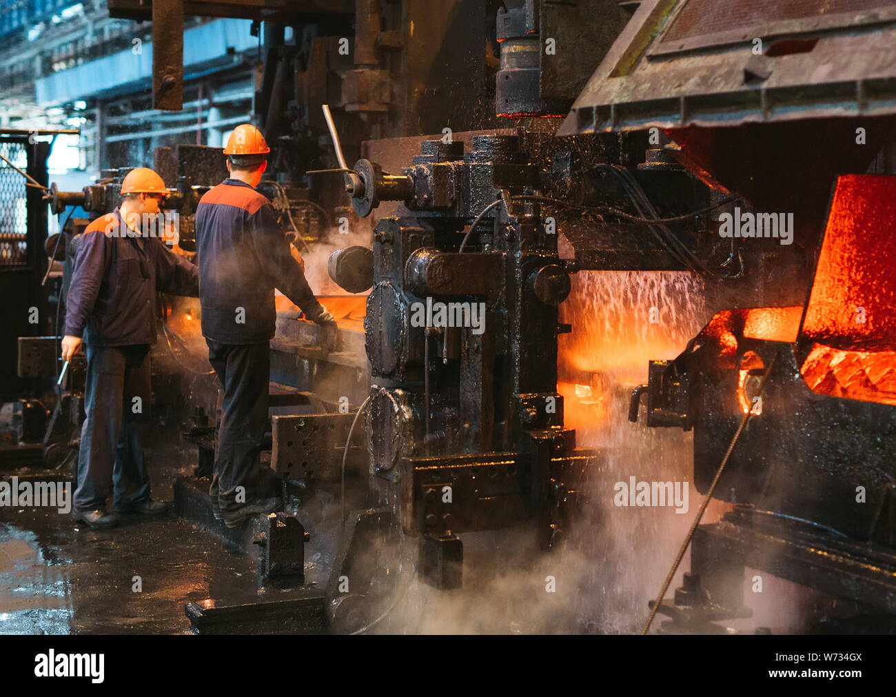 Workers in the steel mill. Metallurgical industry Stock Photo - Alamy