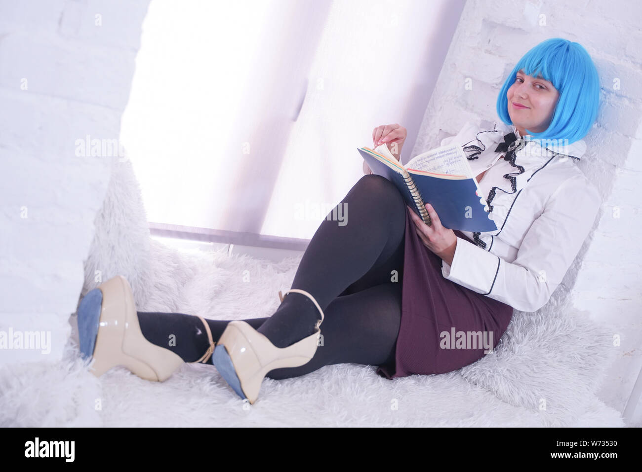 pretty plus size girl in blue wig have many dreams with her diary alone ...