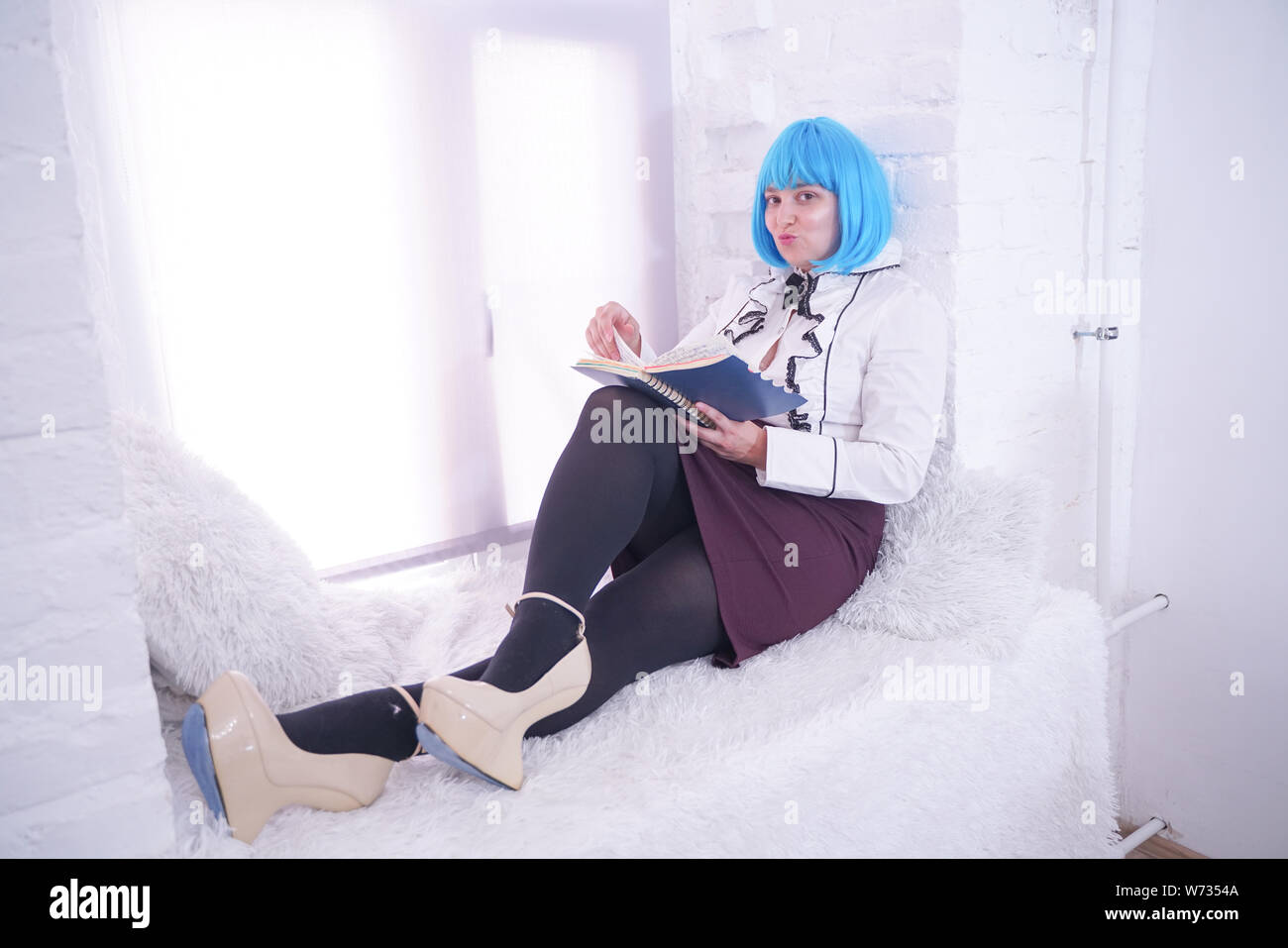pretty plus size girl in blue wig have many dreams with her diary alone ...