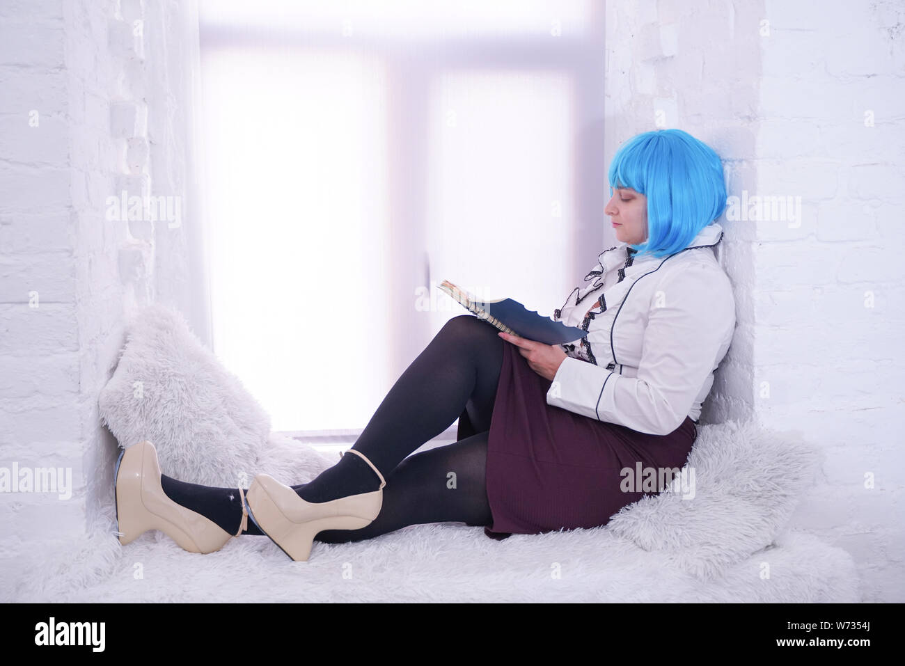 pretty plus size girl in blue wig have many dreams with her diary alone ...