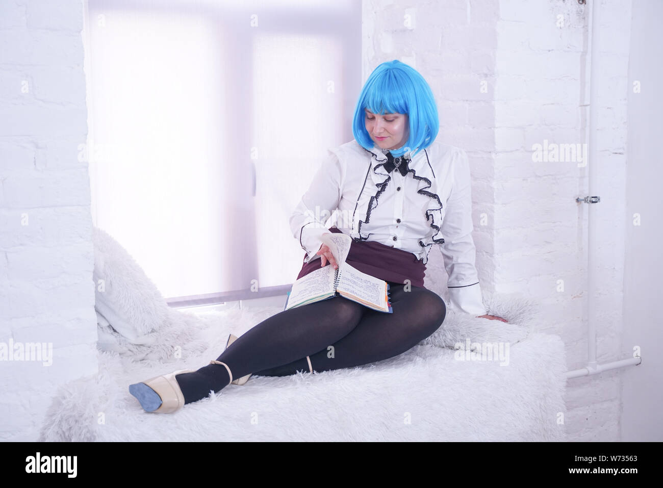 pretty plus size girl in blue wig have many dreams with her diary alone ...