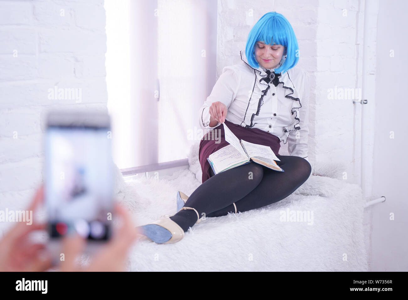 pretty plus size girl in blue wig have many dreams with her diary alone ...