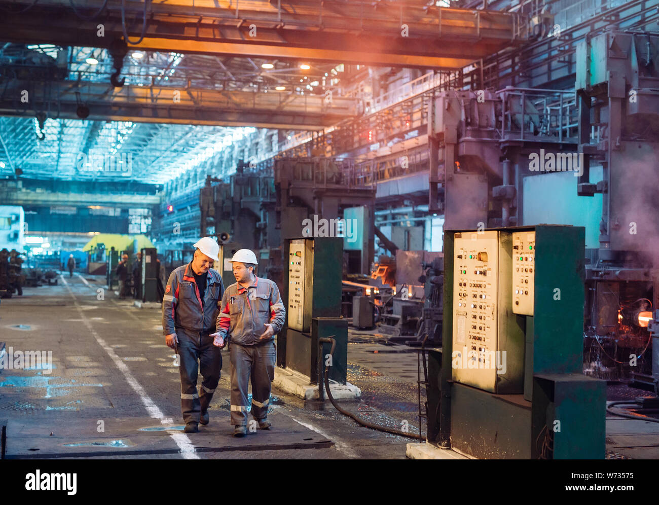 Workers in the steel mill. Metallurgical industry Stock Photo - Alamy