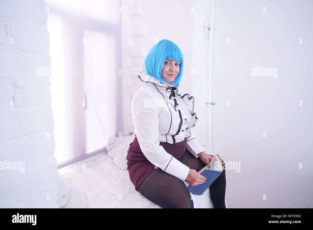 pretty plus size girl in blue wig have many dreams with her diary alone ...