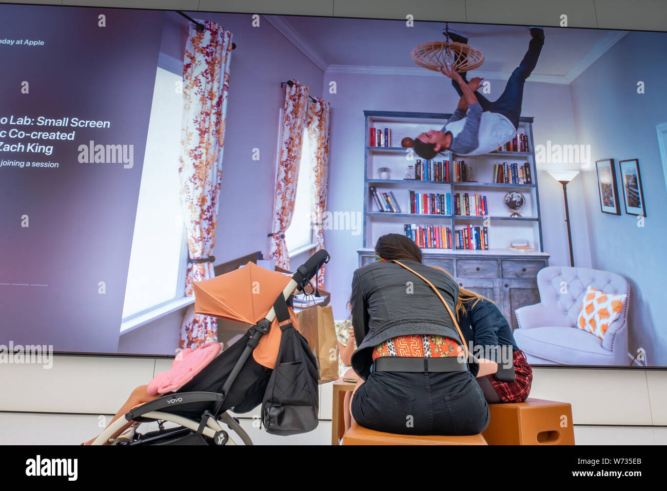 apple store advertising screen in store, walking on wall Stock Photo ...